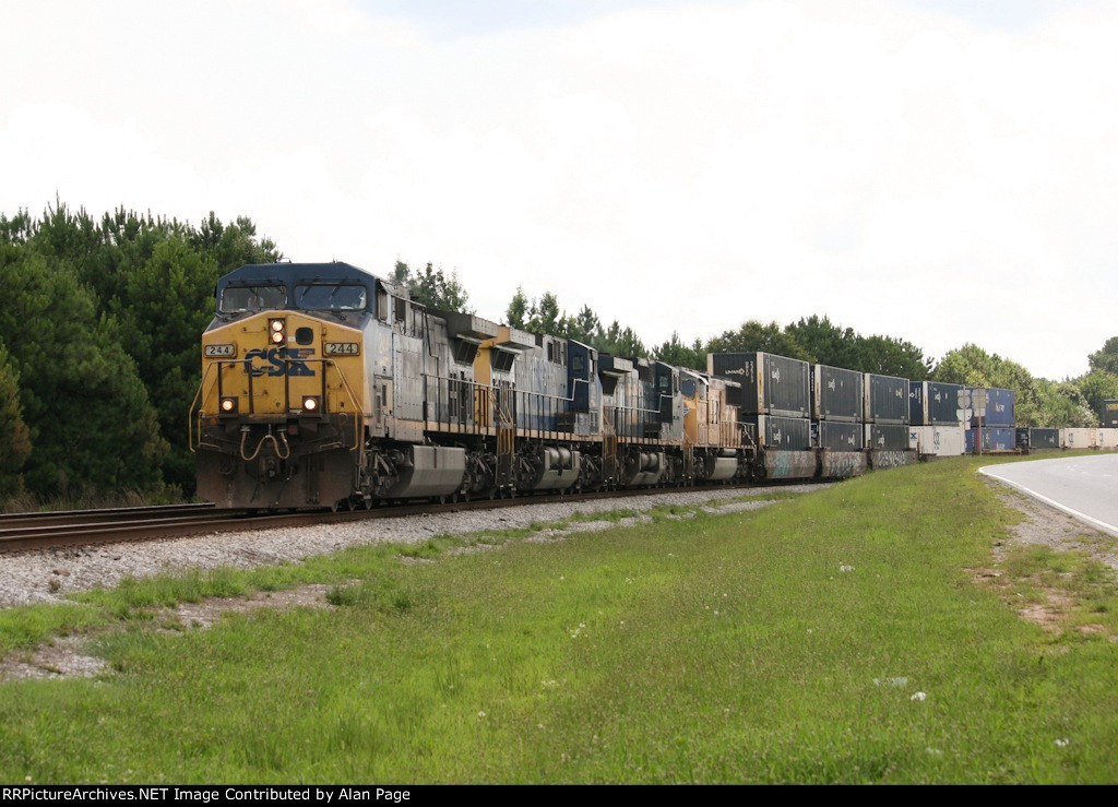 CSX AC44CW 244 leads sister-unit 279, C40-8W 7926, and UP SD70M 4294 to a stop